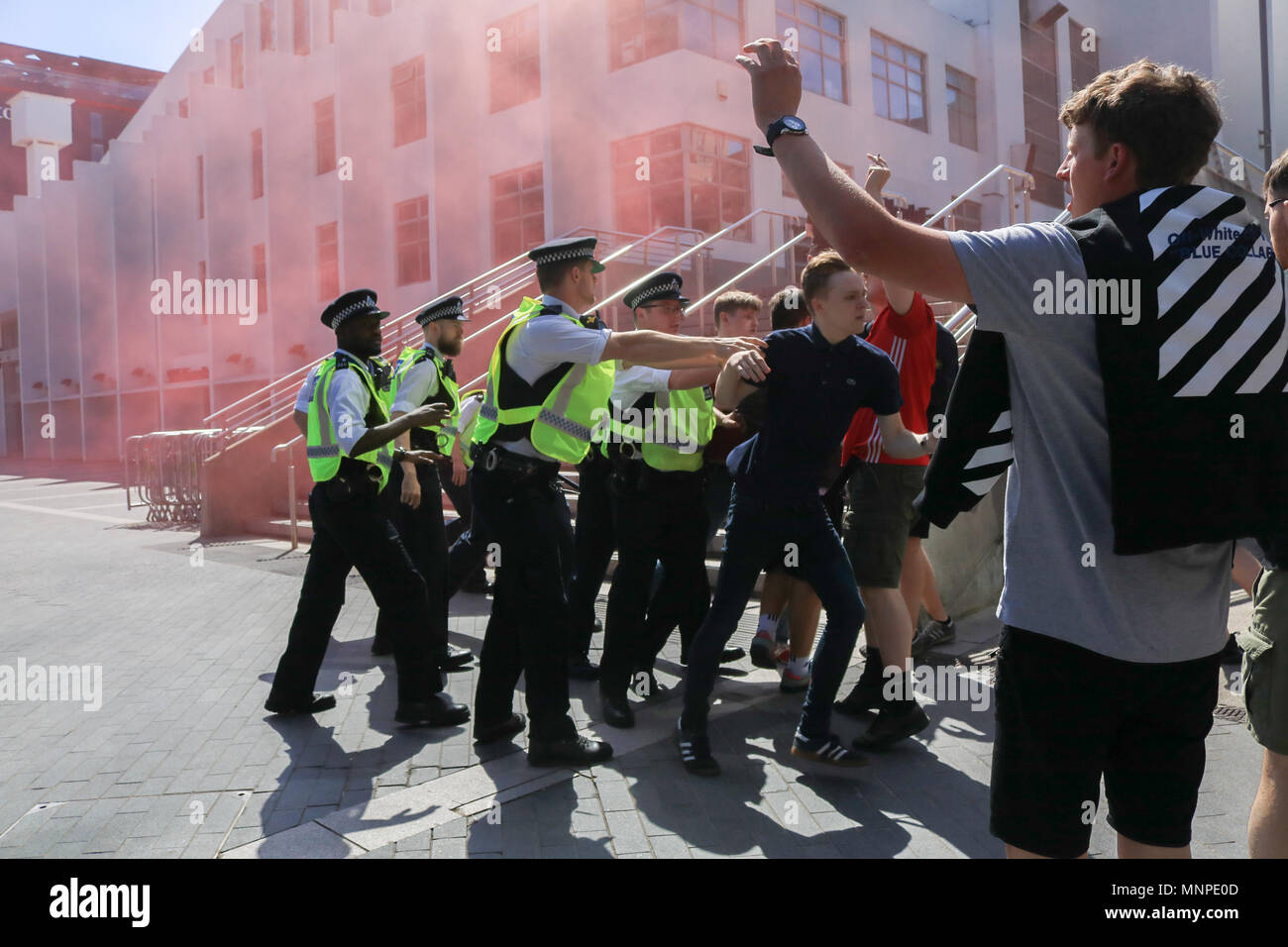 Wembley Middlesex, UK. 19th May 2018. Red smoke flares are thrown in ...