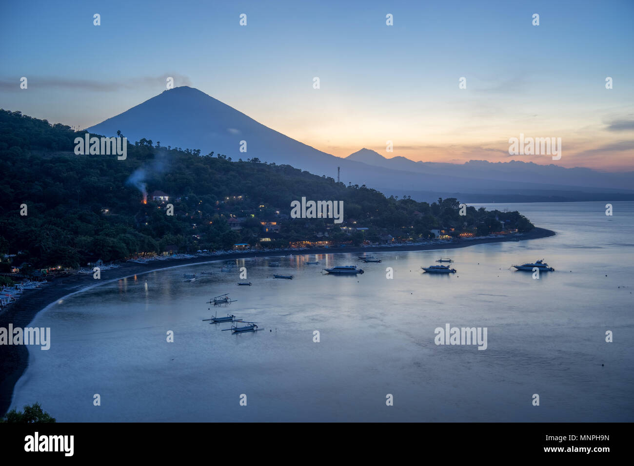 Jemeluk, Amed, Bali, Indonesia, 19 May 2018. Eruption of Mt. Agung seen ...