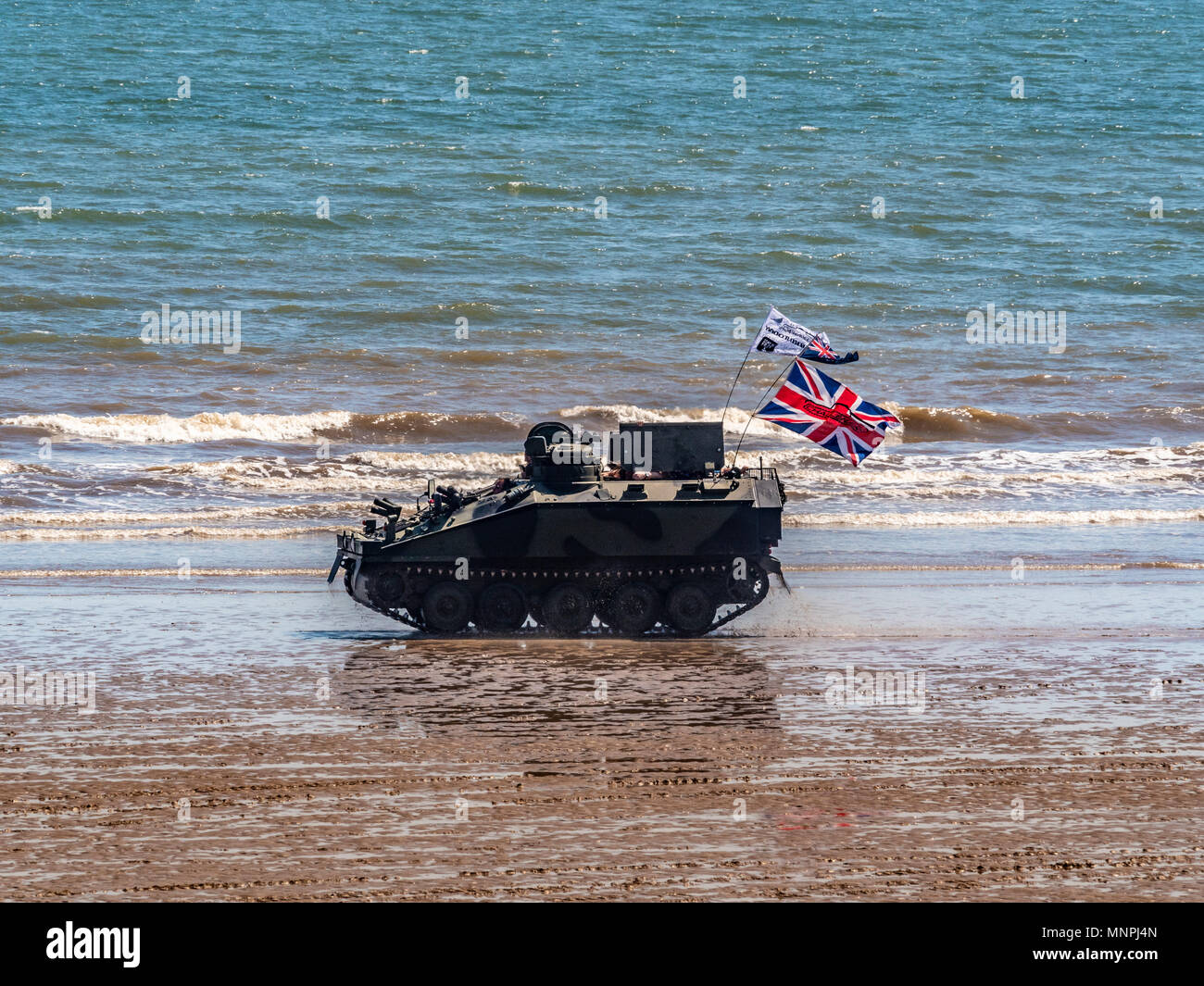 Filey, UK. 19th May, 2018. Tank rides take place on the beach during ...