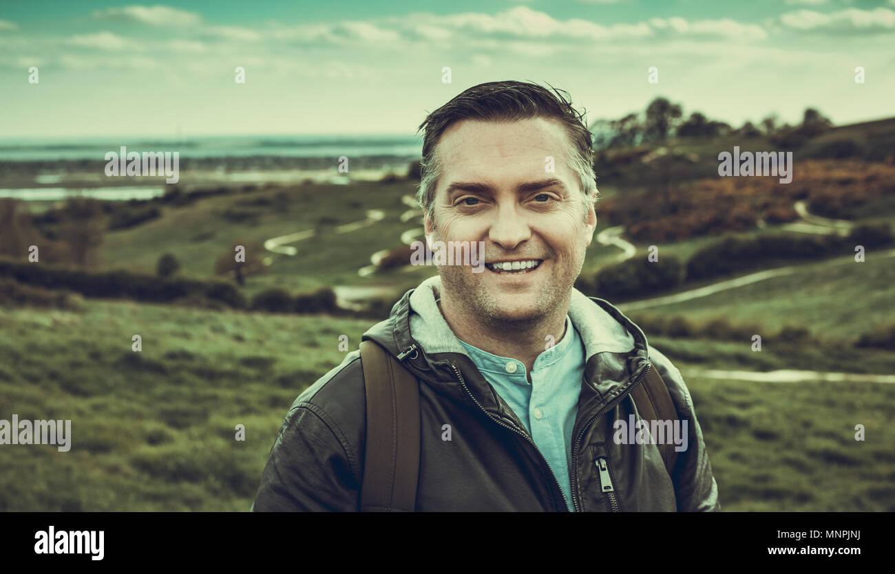 a smiling tourist photographed in Hadleigh Park, Essex, UK Stock Photo ...