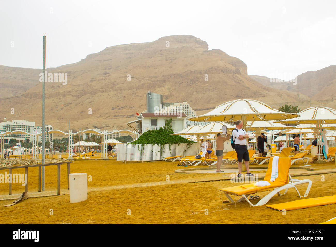 The Ein Bokek beach at the Lot Hotel on the Dead Sea in Judea Israel. Tourists enjoying the ...
