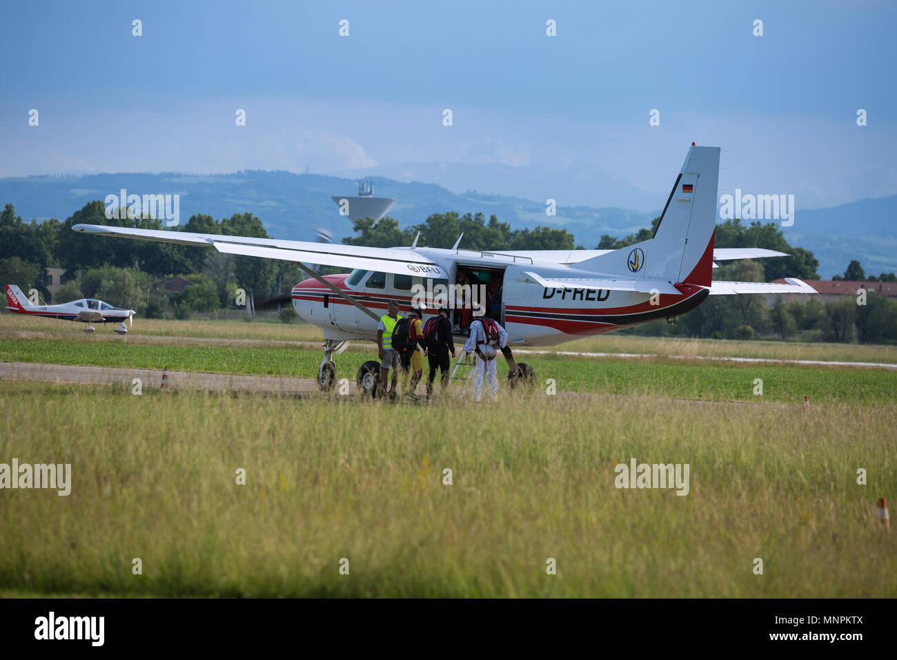 Parachutist Boarding inside White Piper Aircraft: Parachuting Training ...