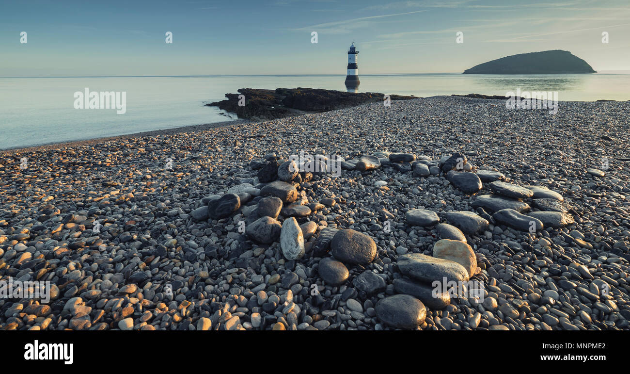 Circle of stones on marble beach in Penmon, North Wales, UK Stock Photo ...