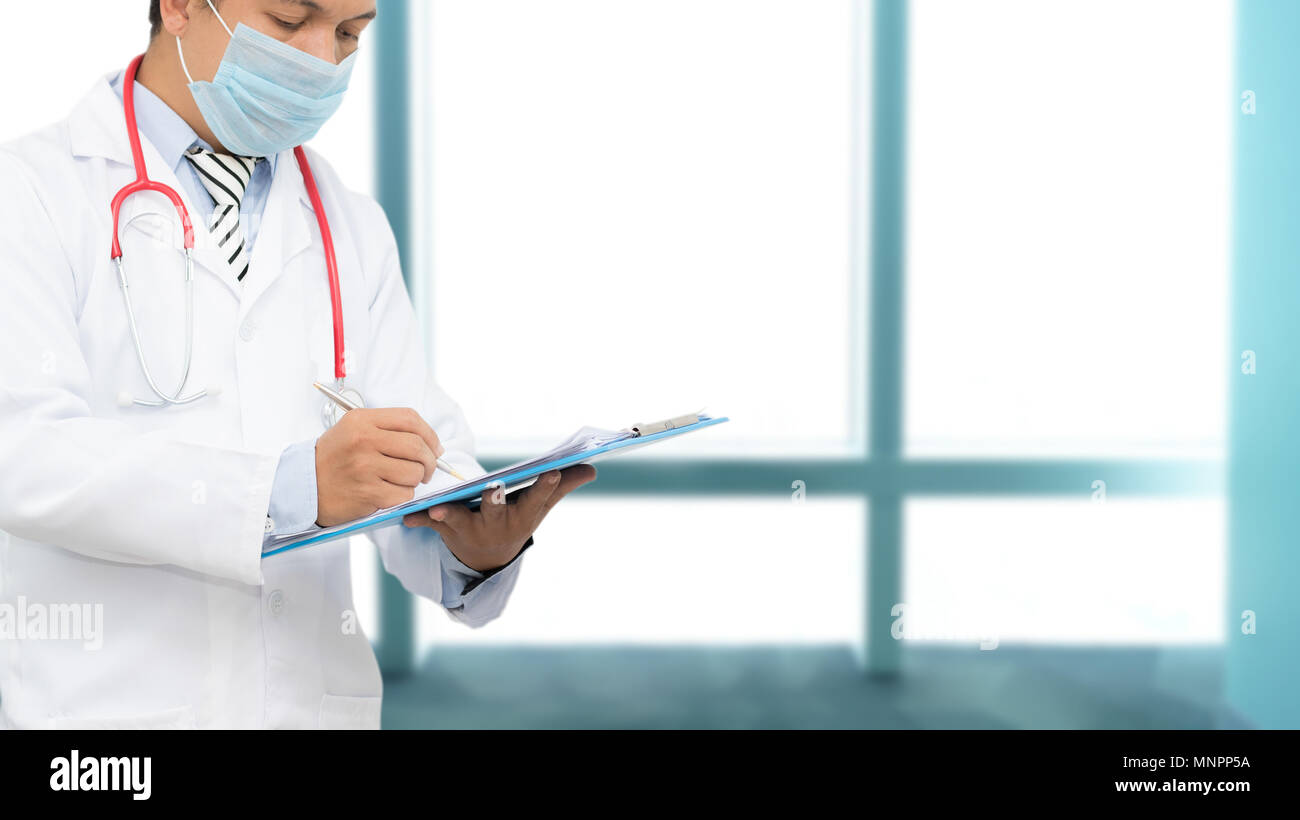 Doctor writing and filling patient registraton form, Healthcare ...