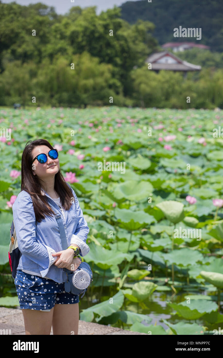 Chinese lady standing hi-res stock photography and images - Alamy