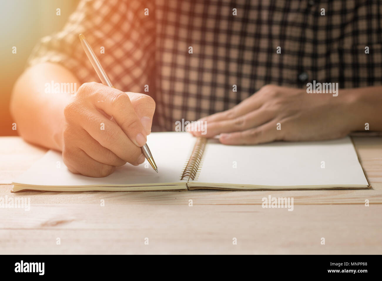 hand writing on notebook in dark tone Stock Photo - Alamy