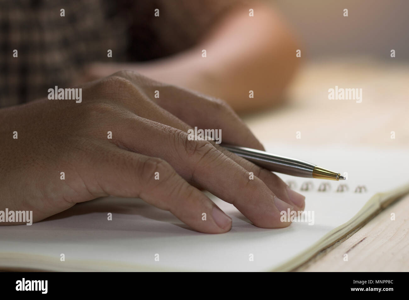 Hands drawing in note book hi-res stock photography and images - Alamy