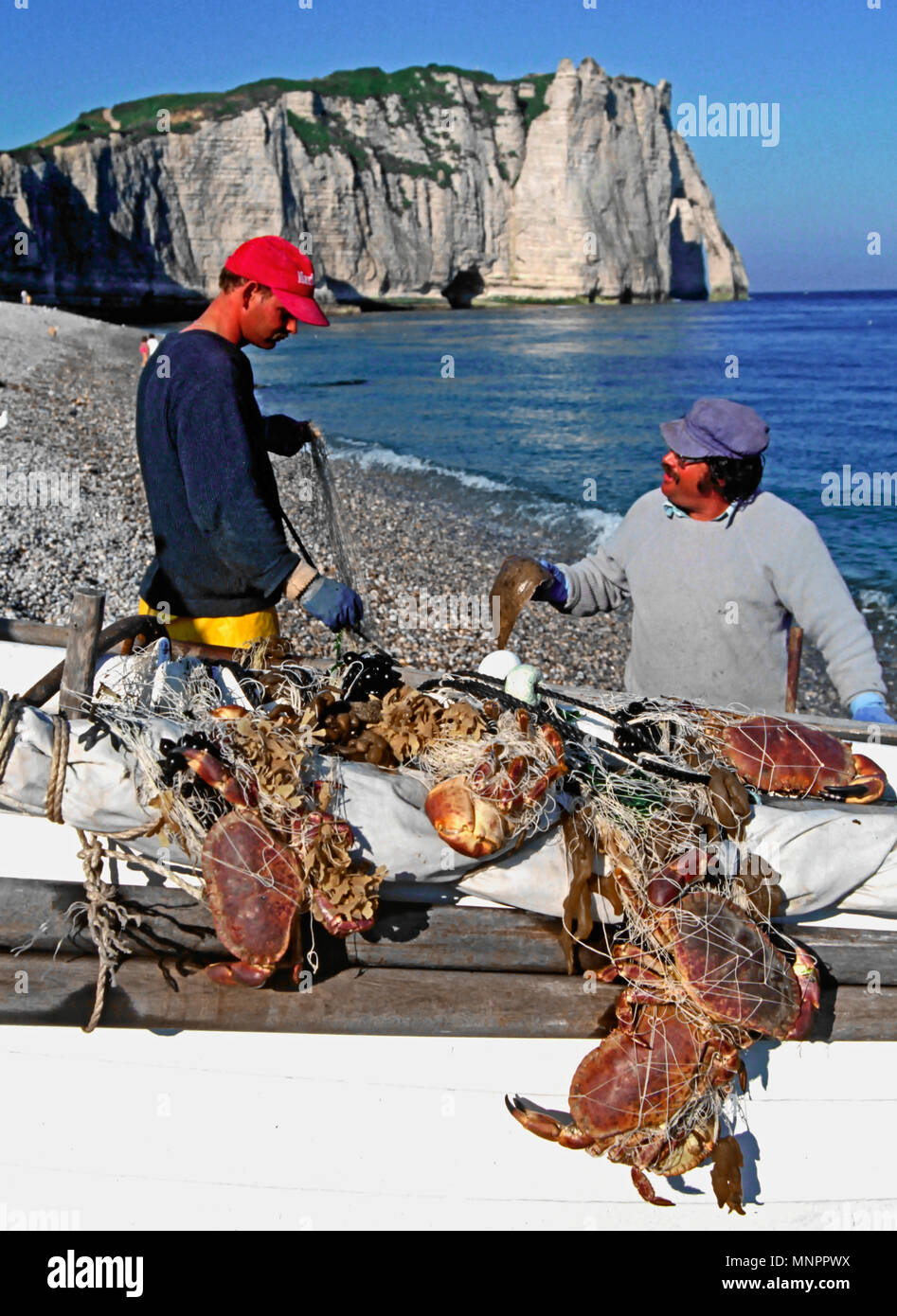 FISHERMEN WITH THEIR CATCH OF SHELLFISH. ETRETAT. NORMANDY. FRANCE ...