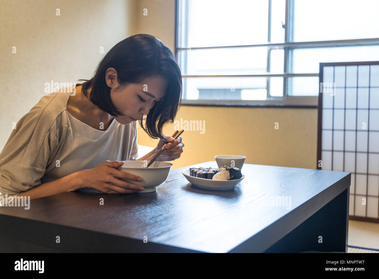 Tokyo girl eating sushi hi-res stock photography and images - Alamy