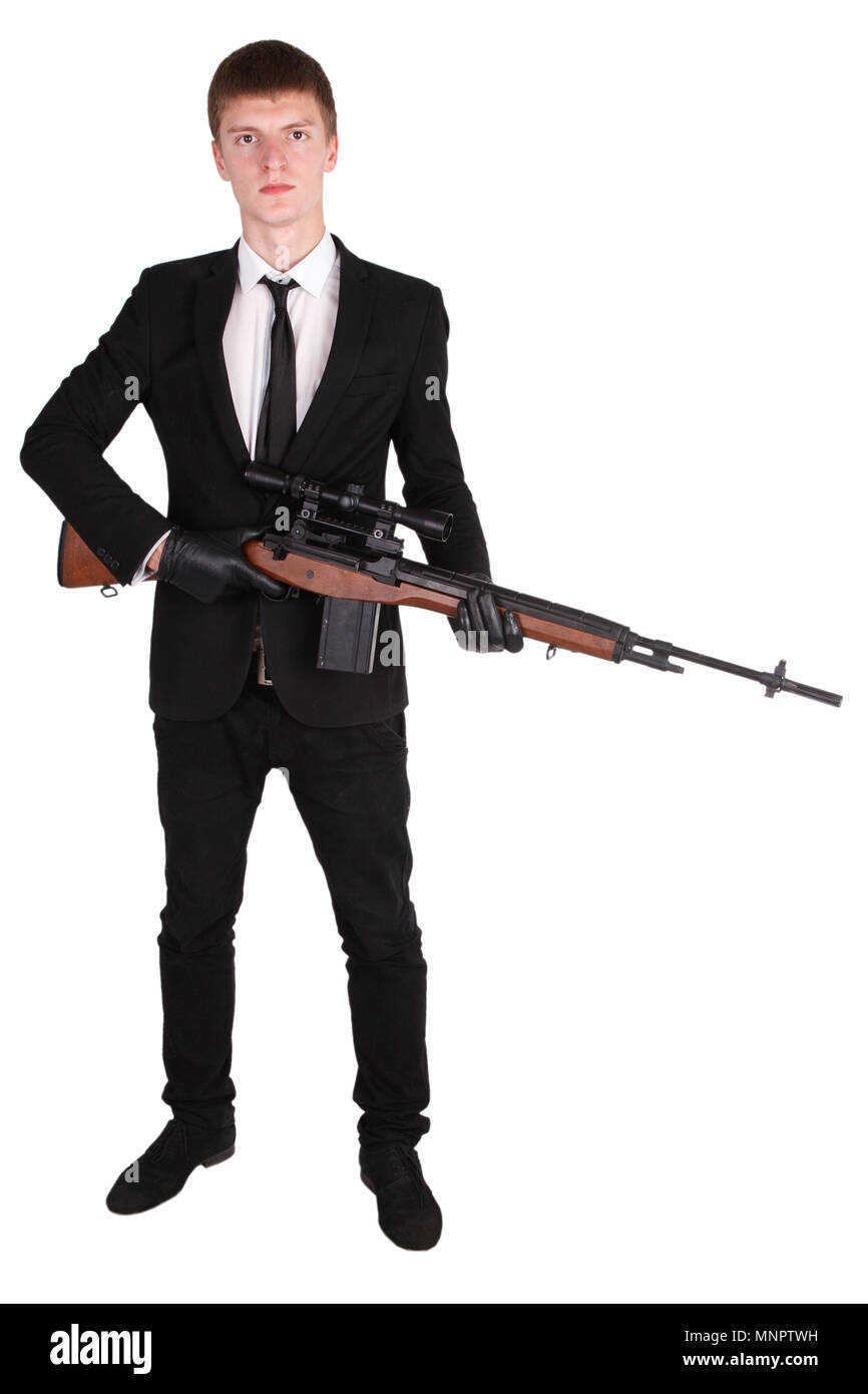 Man in suit with sniper rifle isolated on white Stock Photo - Alamy