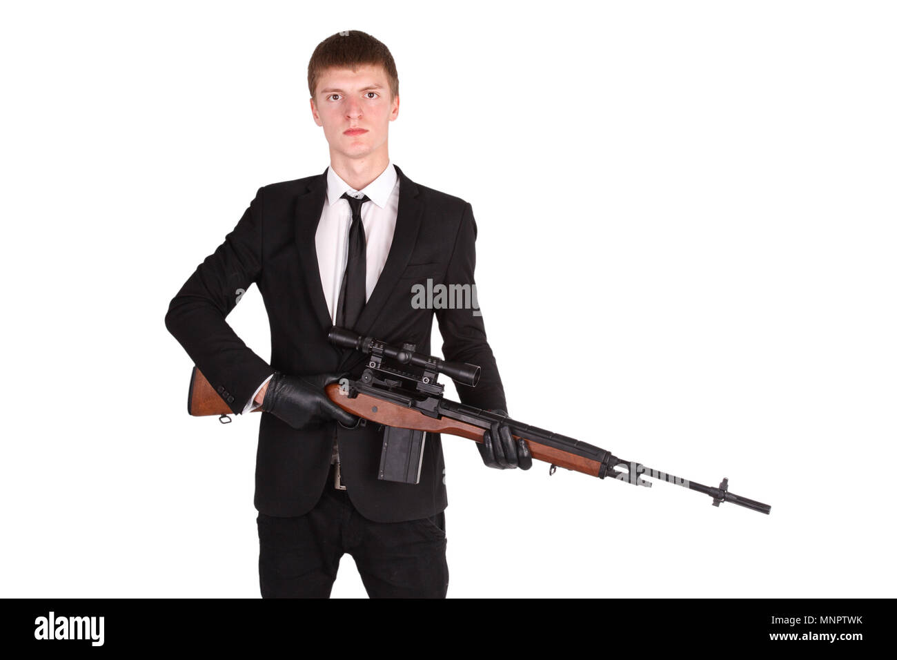 Man in suit with sniper rifle isolated on white Stock Photo - Alamy