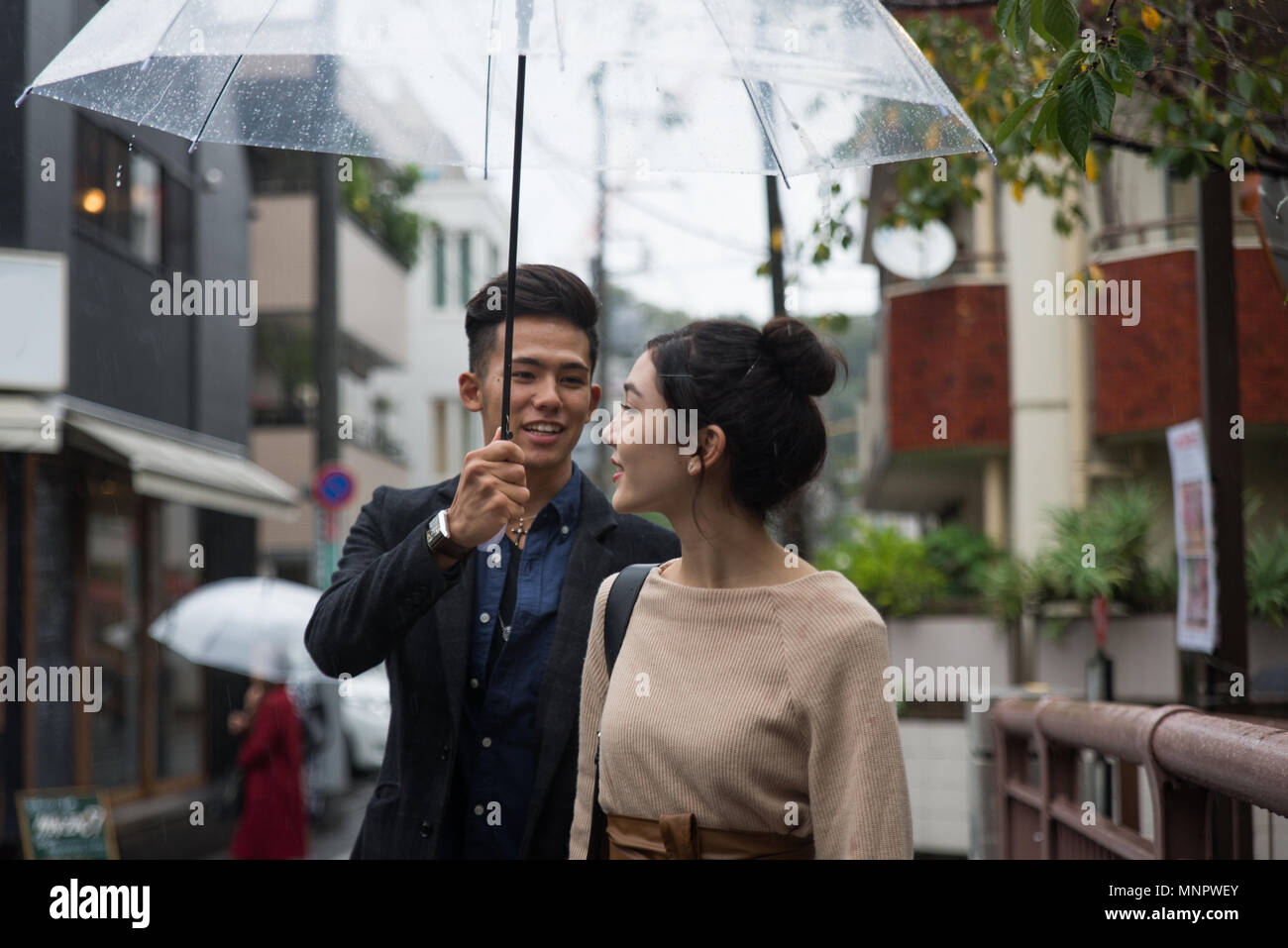 Beautiful happy couple dating in Tokyo Stock Photo - Alamy