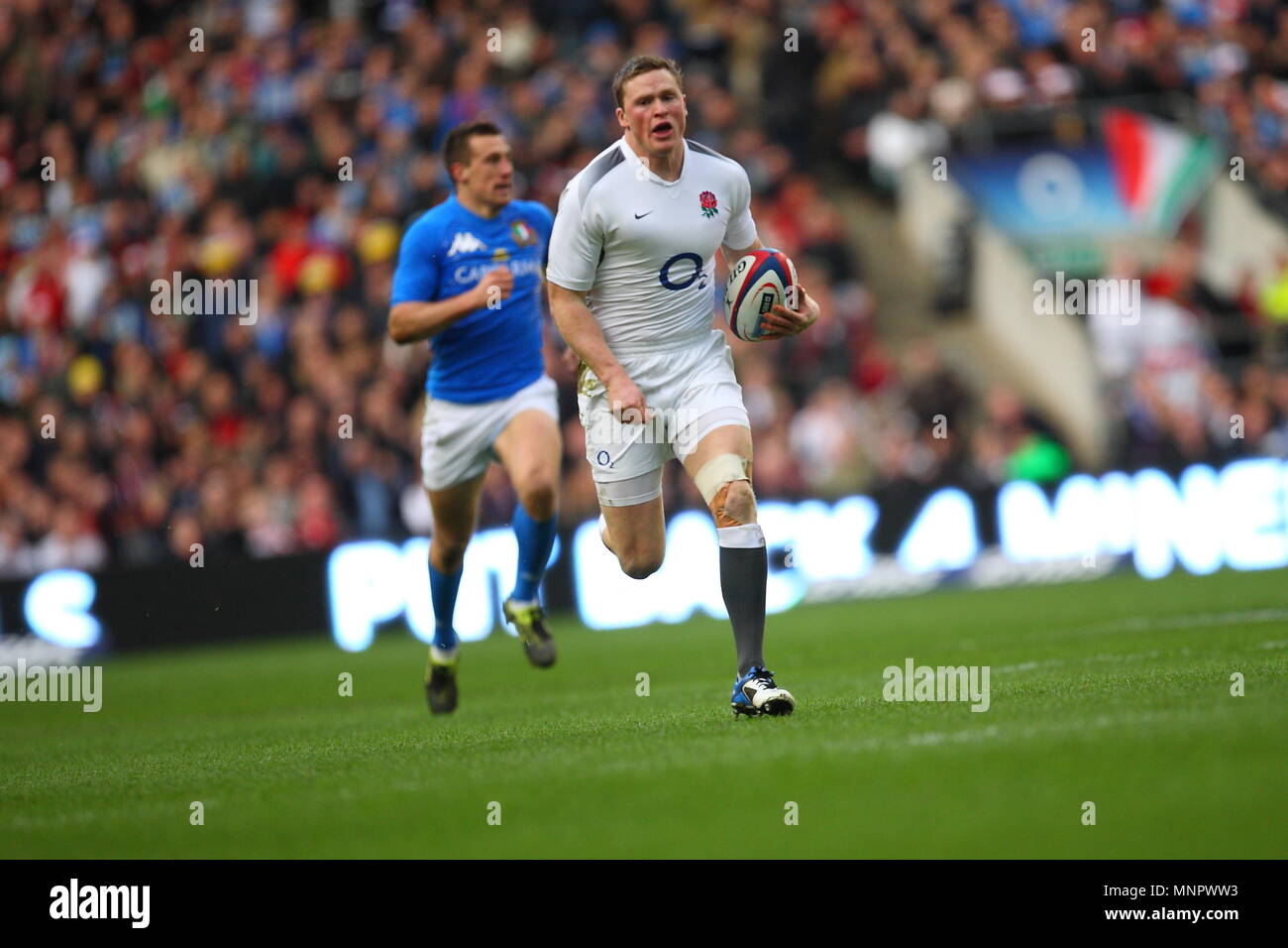 Chris Ashton of England races for the line to score the first try of ...