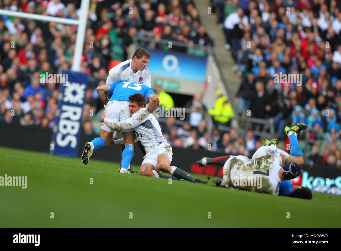 Toby Flood and Chris Ashton of England tackle Gonzalo Canale of Italy ...