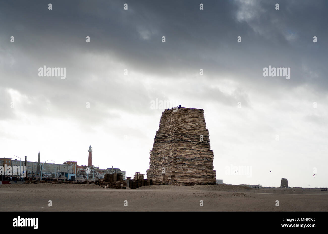 Buiding huge bonfire, old and new, The Netherlands Stock Photo - Alamy