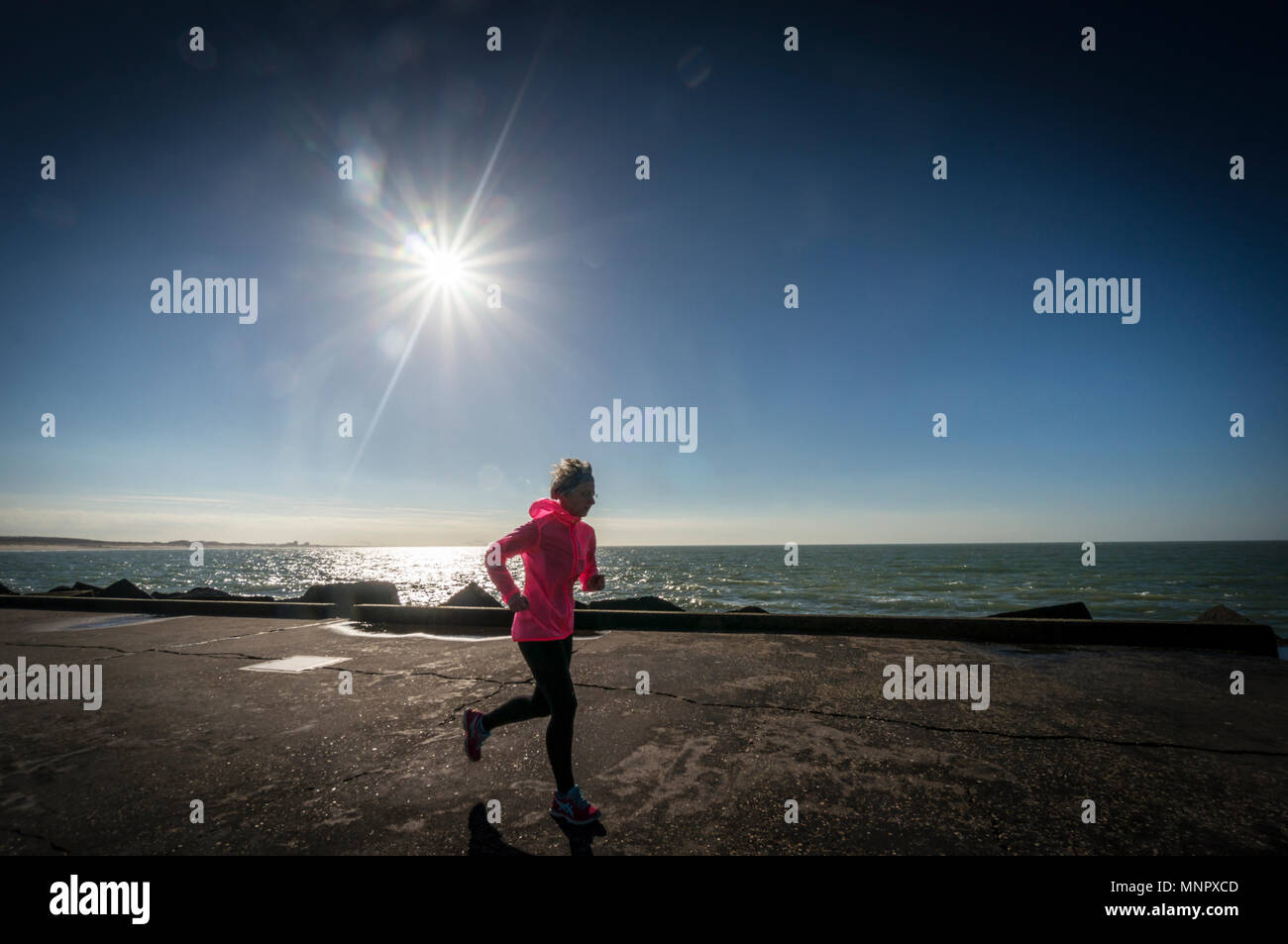 Running on pier hi-res stock photography and images - Alamy
