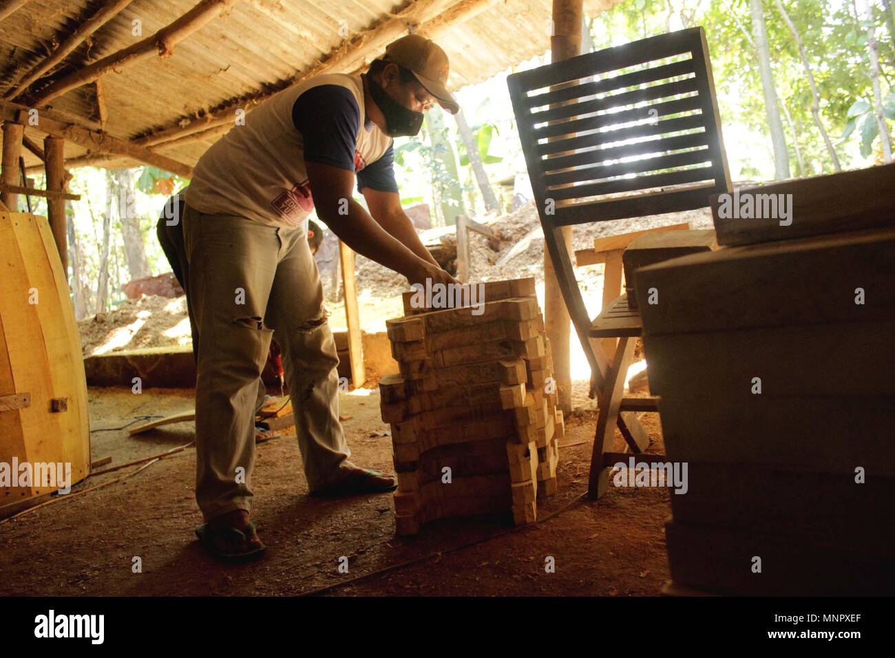Madiun, Indonesia. 18th May, 2018. Workers set up wooden beams are ...