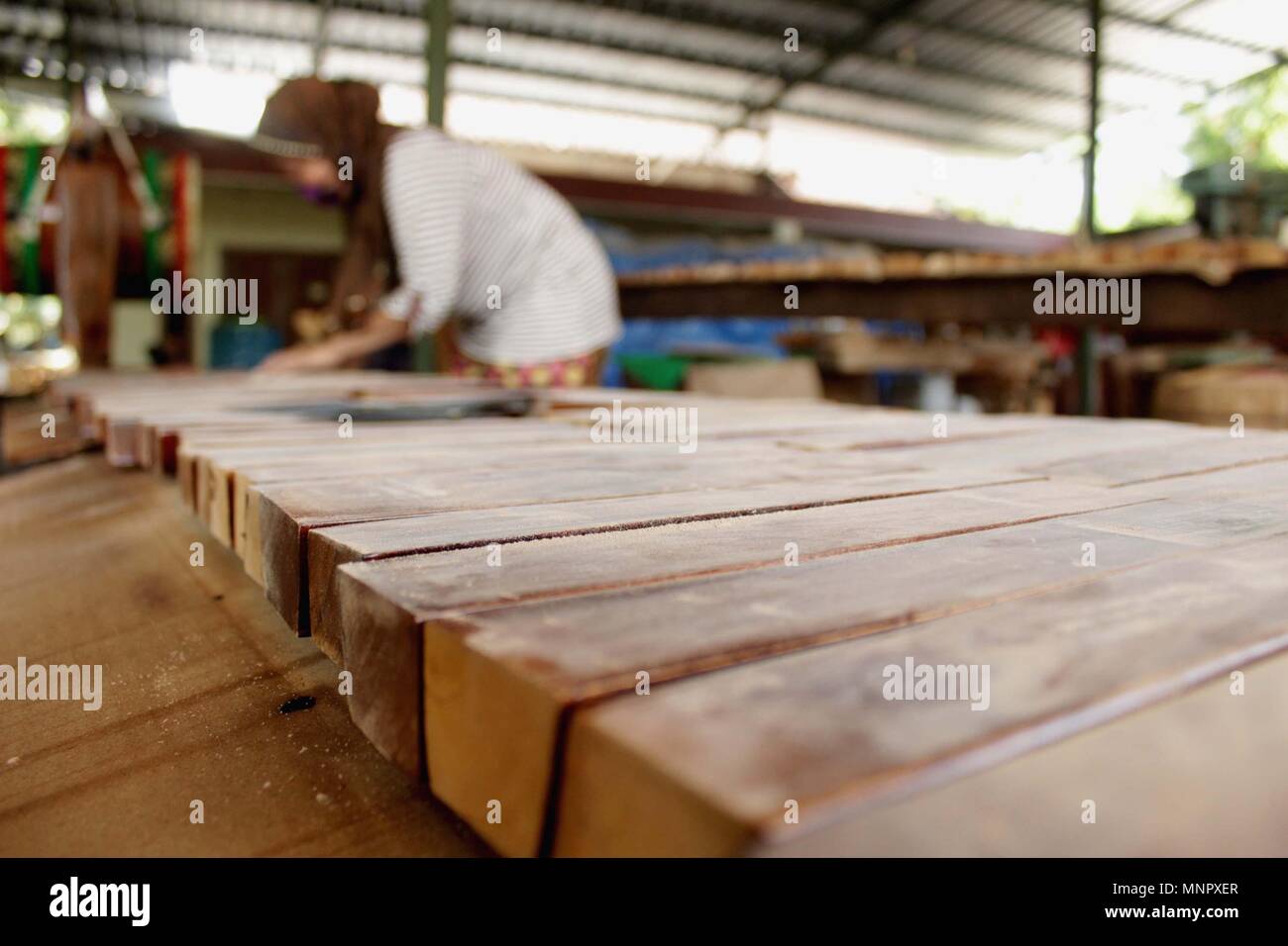 Madiun, Indonesia. 18th May, 2018. Workers set up wooden beams are ...