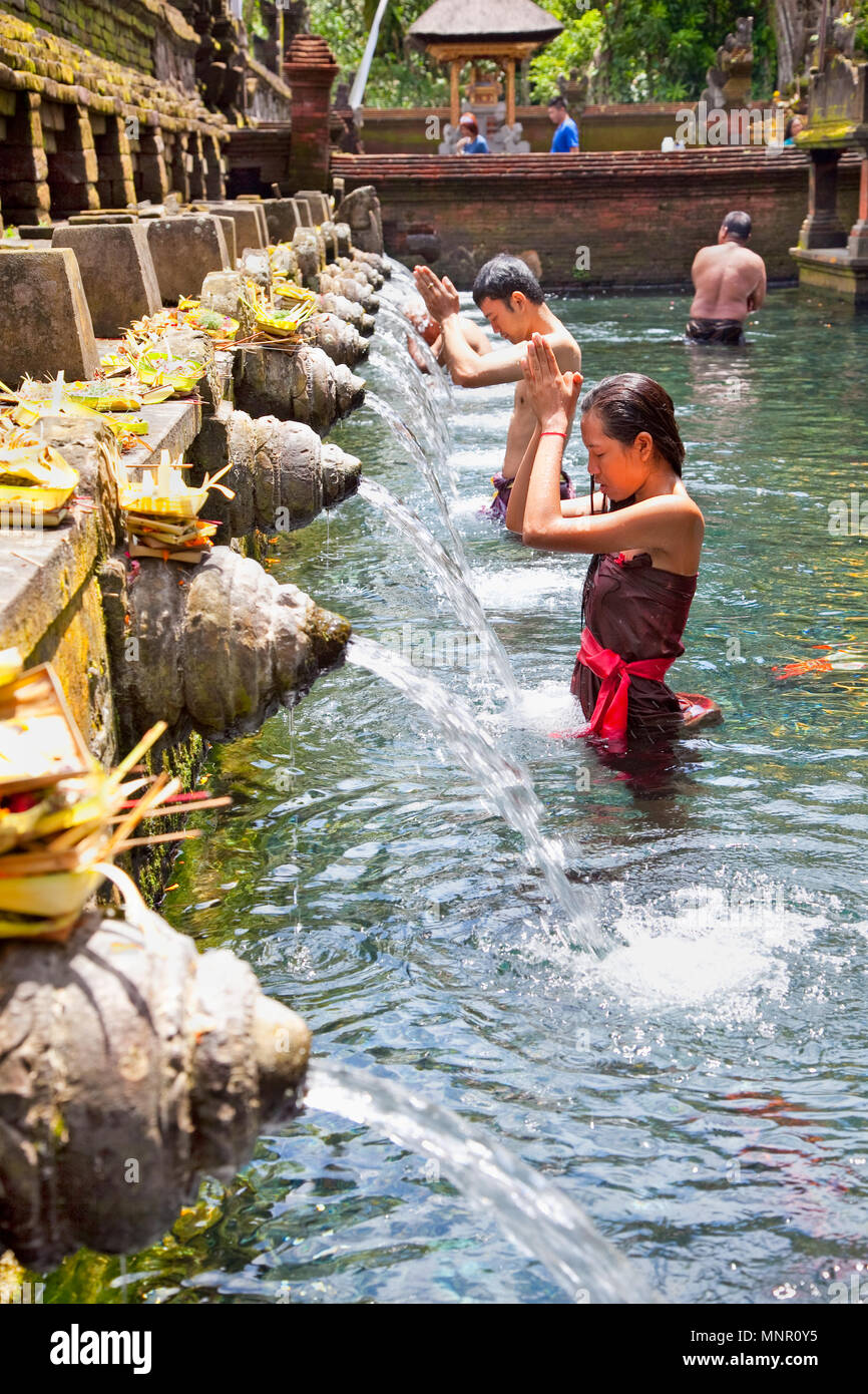 TAMPAK SIRING, BALI, INDONESIA - JANUARY 26: People praying at holy ...