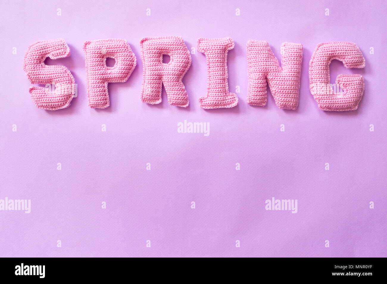spring word from knitted letters Stock Photo - Alamy