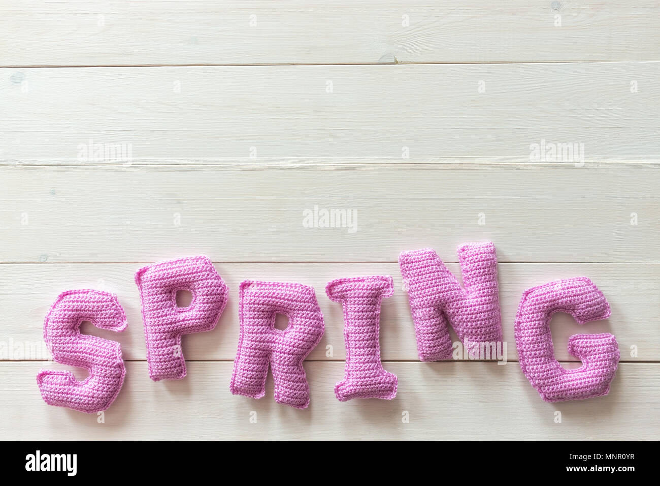 spring word from knitted letters Stock Photo - Alamy