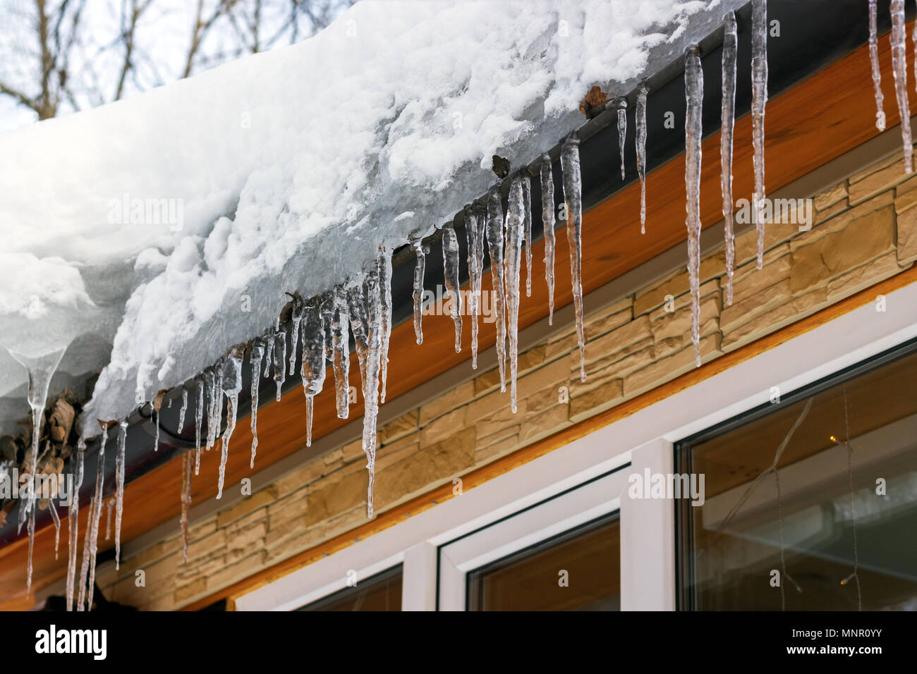 Big icicles on house hi-res stock photography and images - Alamy