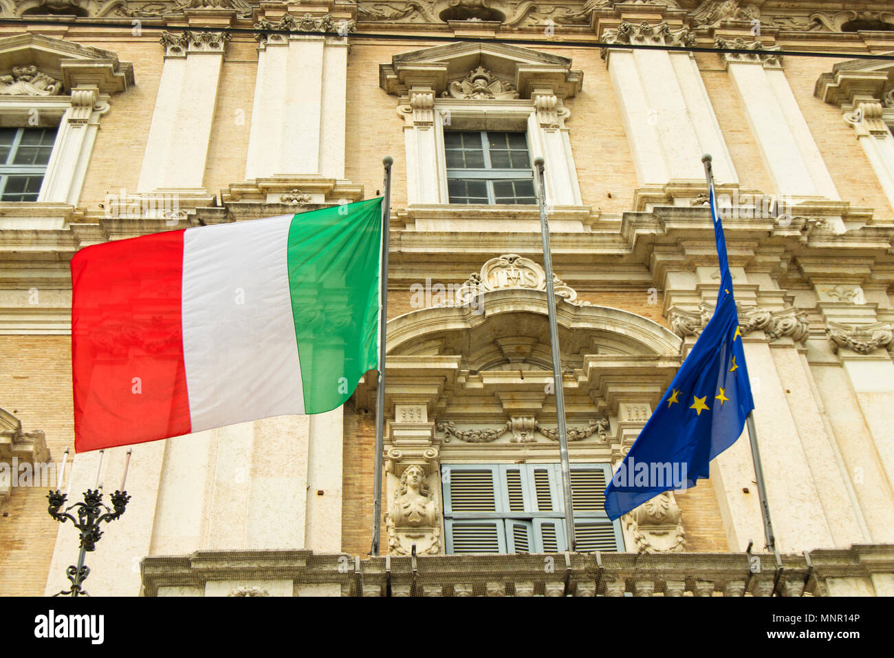 italian and european flags on a balcony of the italian army academy ...