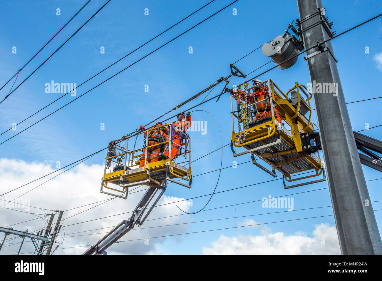 Railway workers working on overhead lines Stock Photo - Alamy