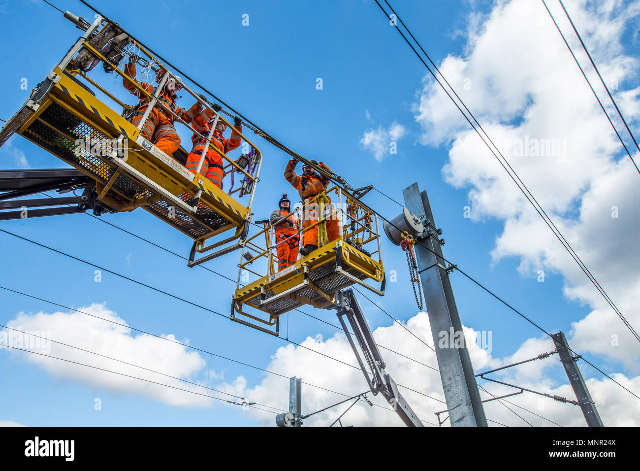 Railway workers working on overhead lines Stock Photo - Alamy