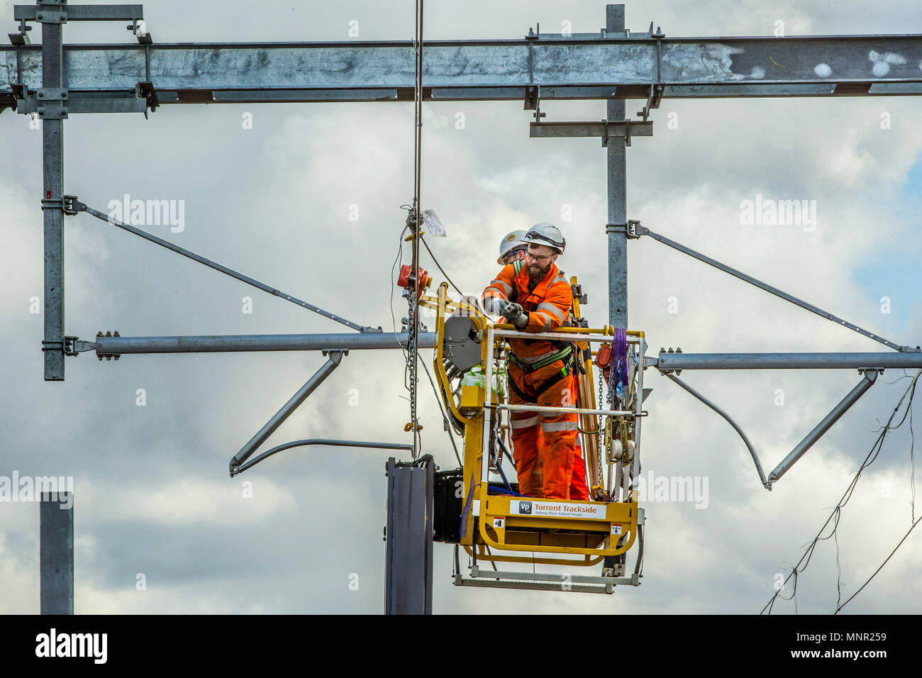 Railway workers working on overhead lines Stock Photo - Alamy