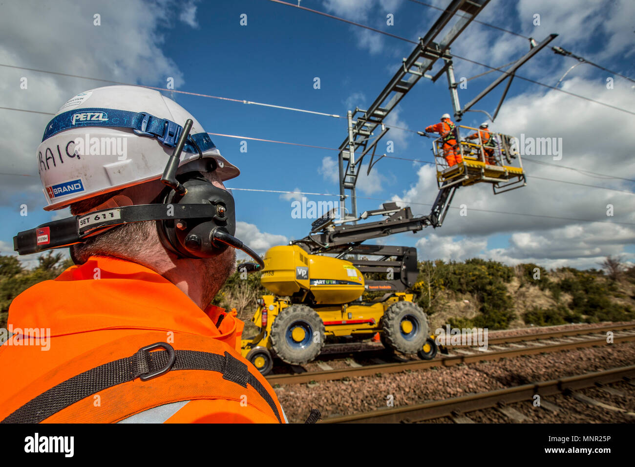 Railway workers working on overhead lines Stock Photo - Alamy