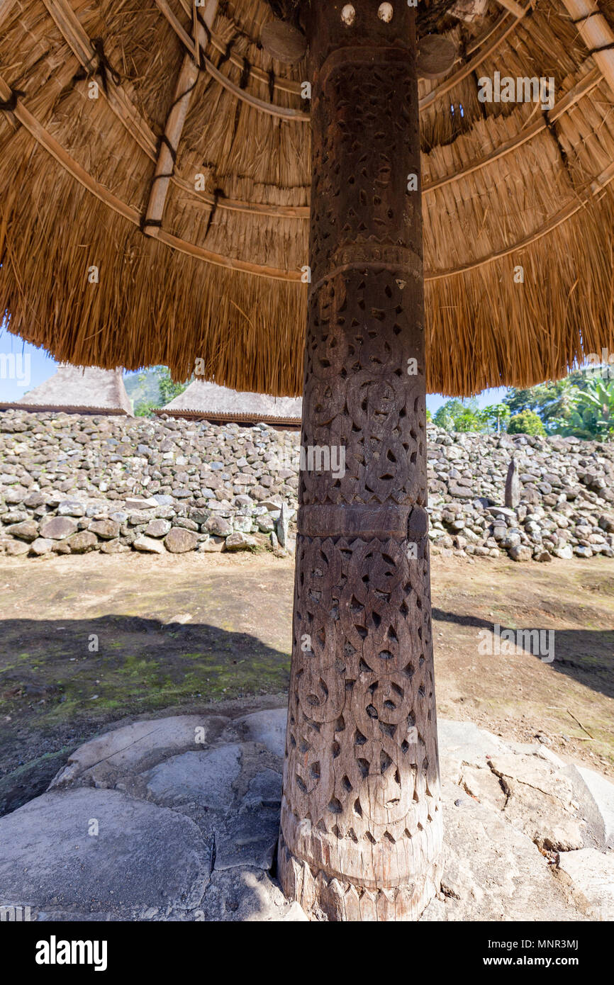 A carving supporting a thatched Ngadhu in the Luba tradtional village ...