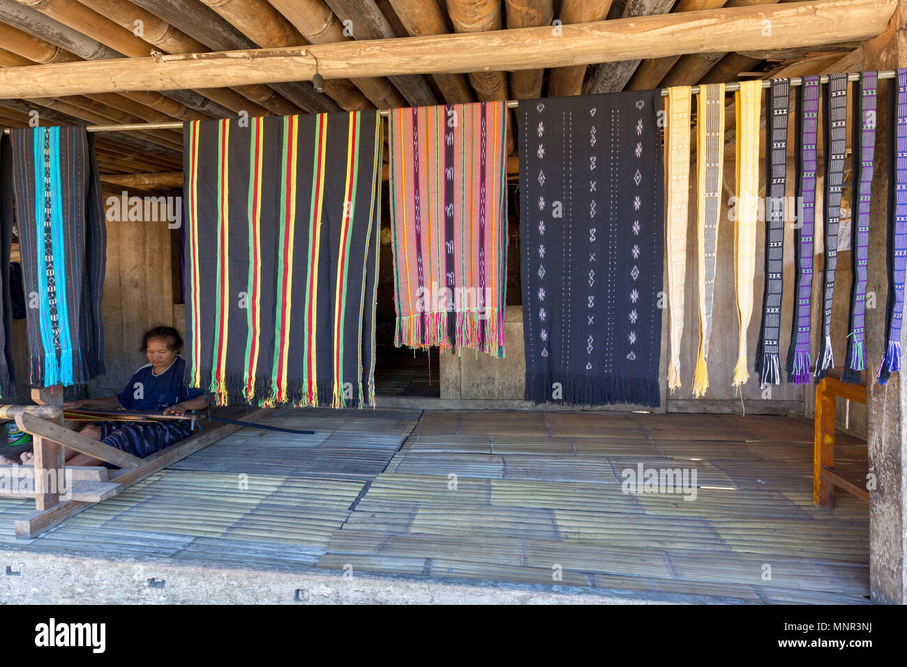 LUBA, INDONESIA - MAY 19: An unidentified woman weaves on her front ...