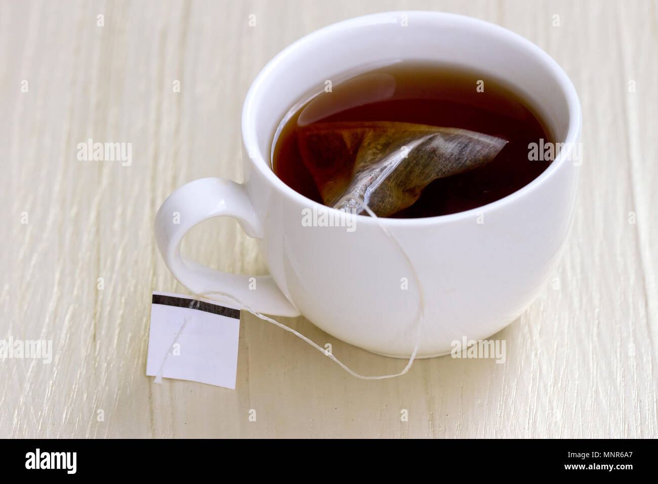 White cup of tea and tea bag Stock Photo - Alamy