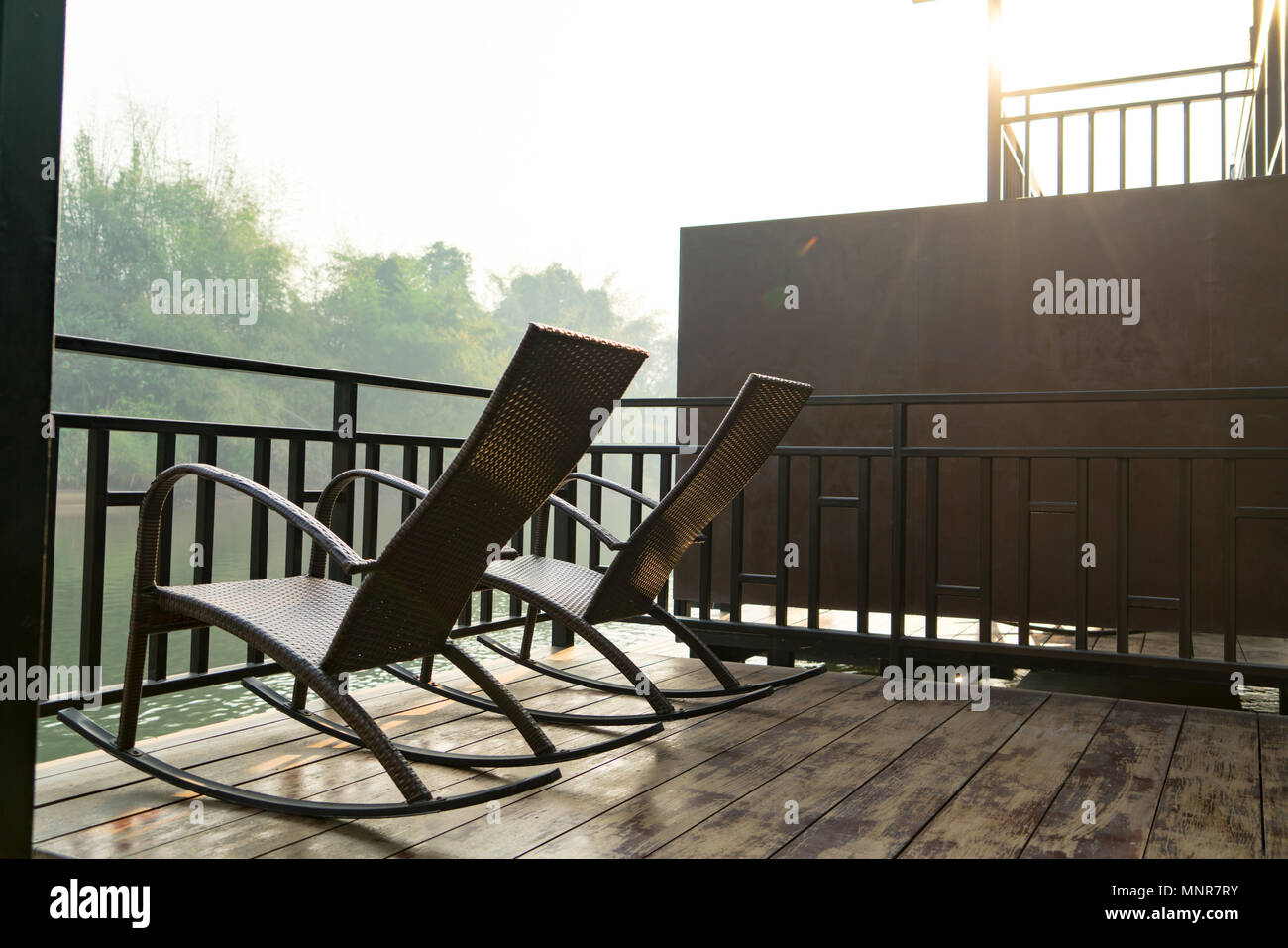 two chairs in morning sunrise at the rafting cottage terrace Stock ...