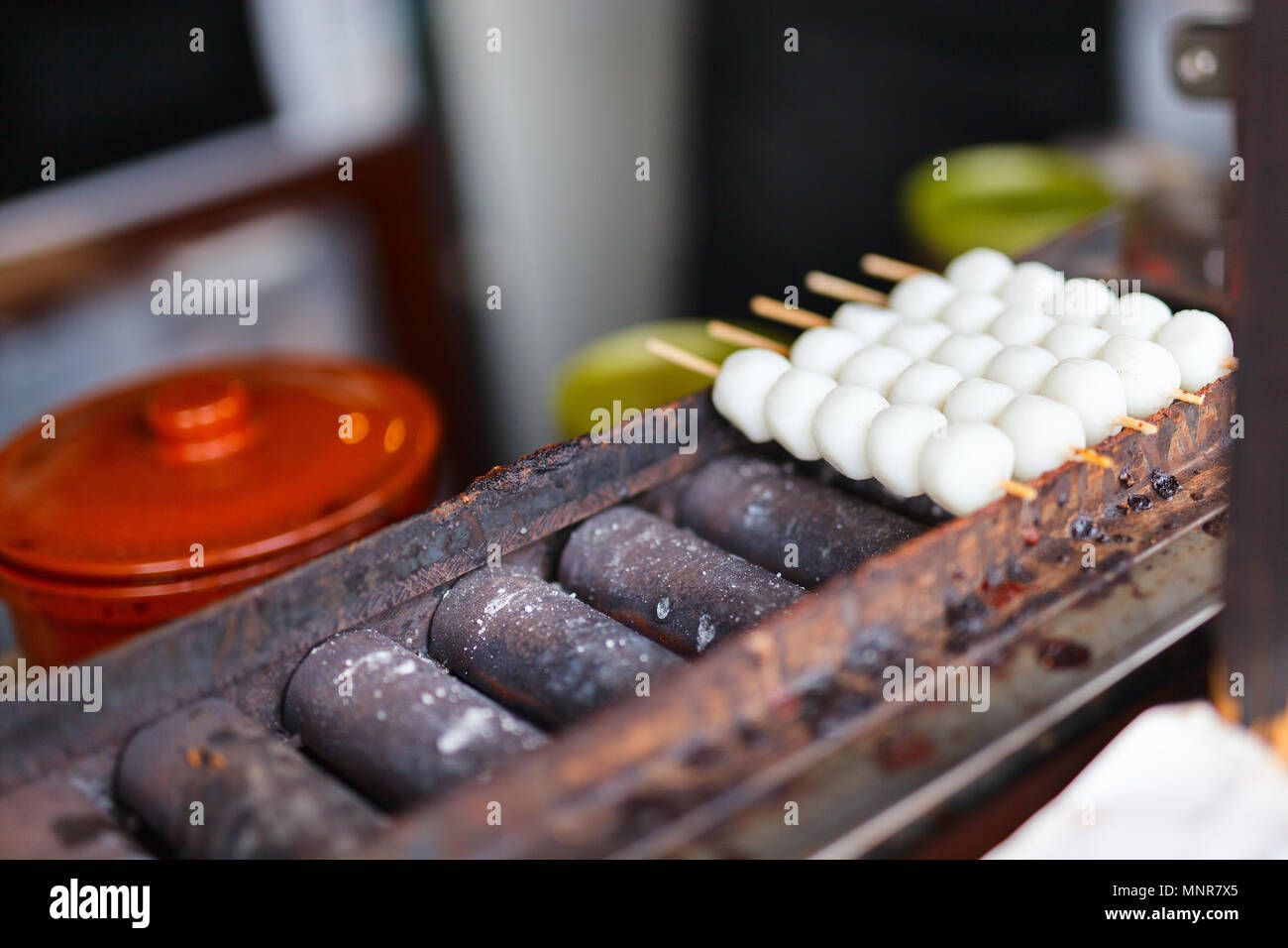 Sweet rice balls famous japanese street food grilled on open fire Stock ...