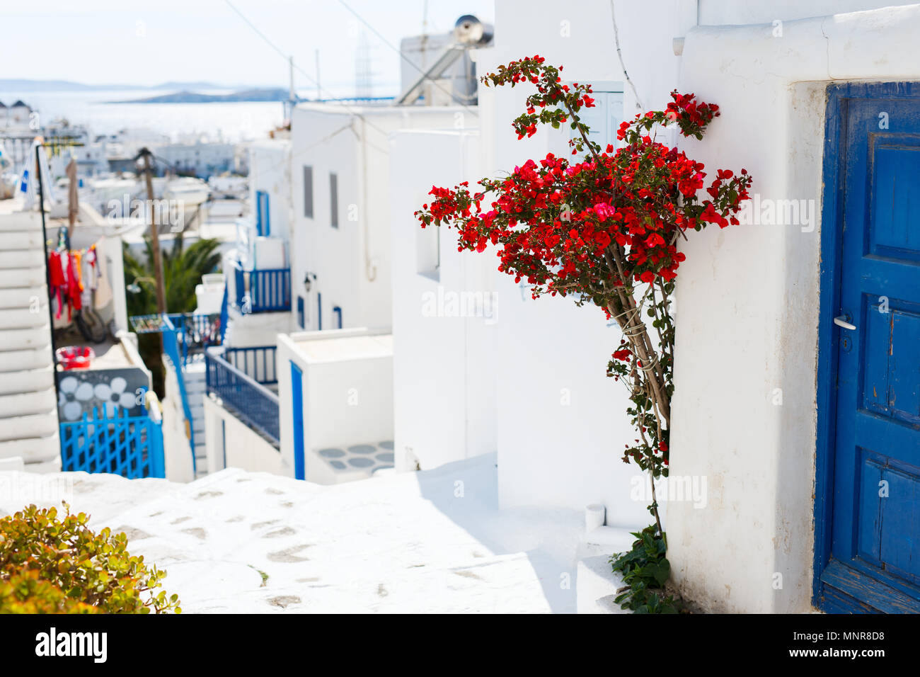 Typical greek traditional village with white walls and colorful doors ...