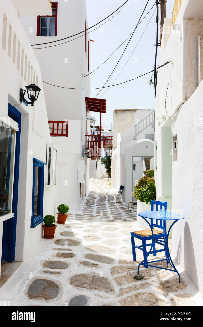 Typical street of greek traditional village with white walls and ...