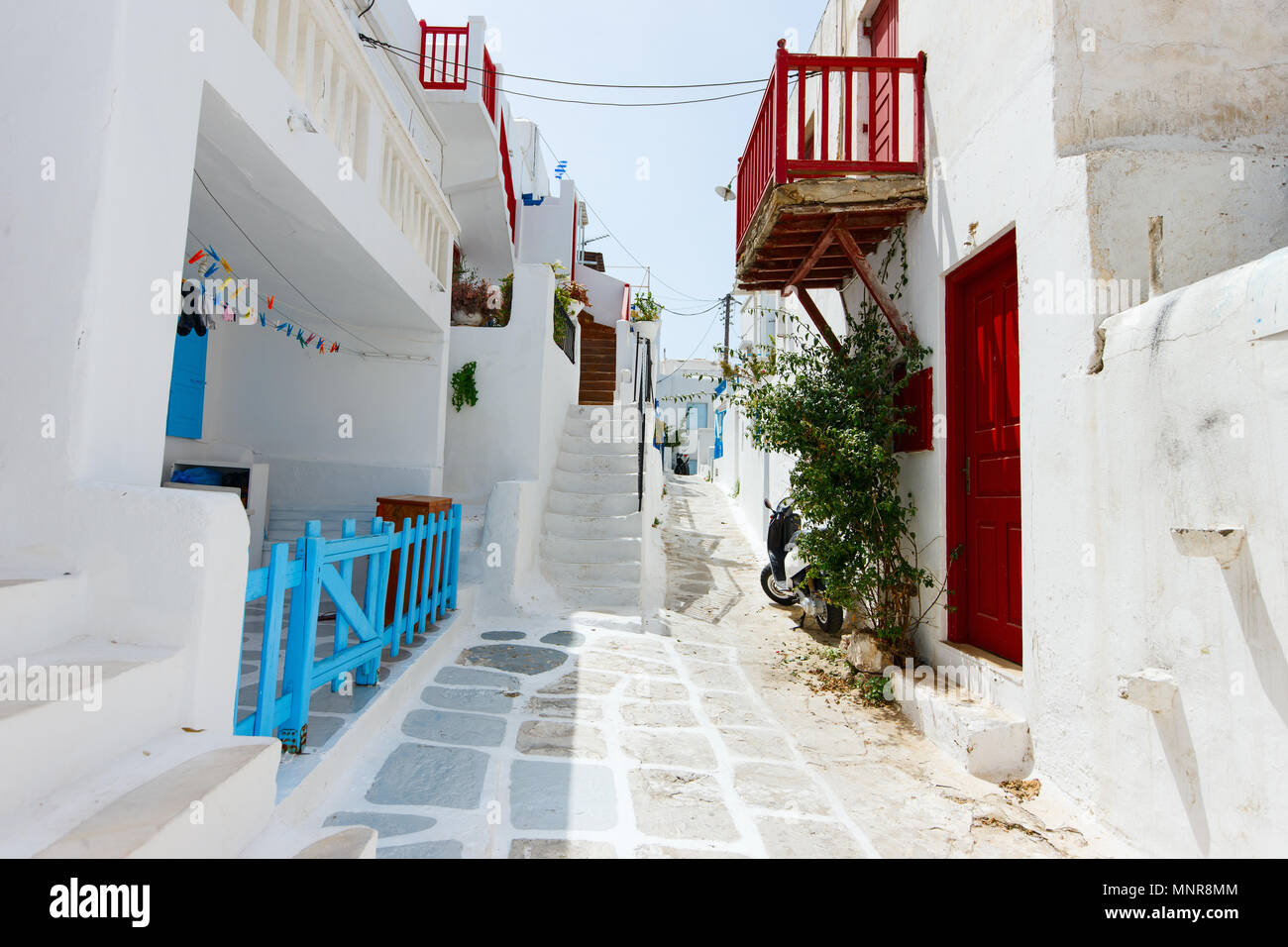 Typical street of greek traditional village with white walls and ...