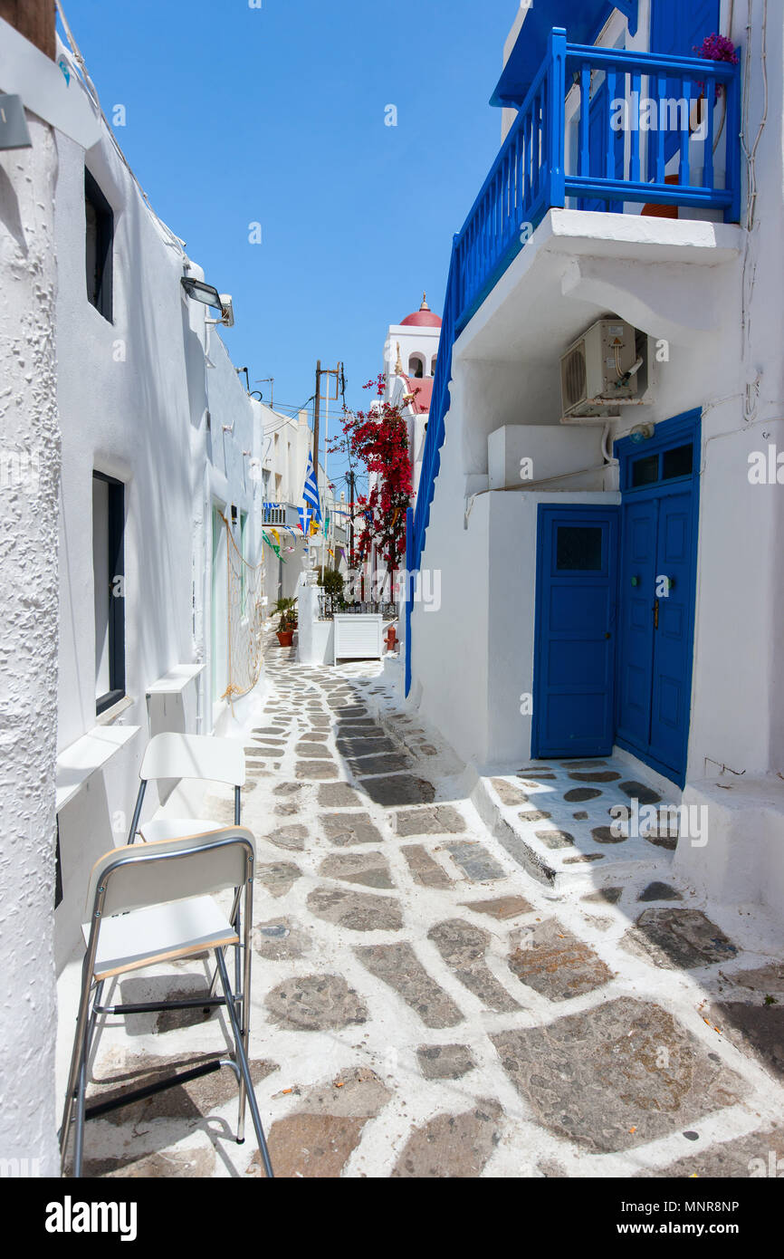 Typical street of greek traditional village with white walls and ...