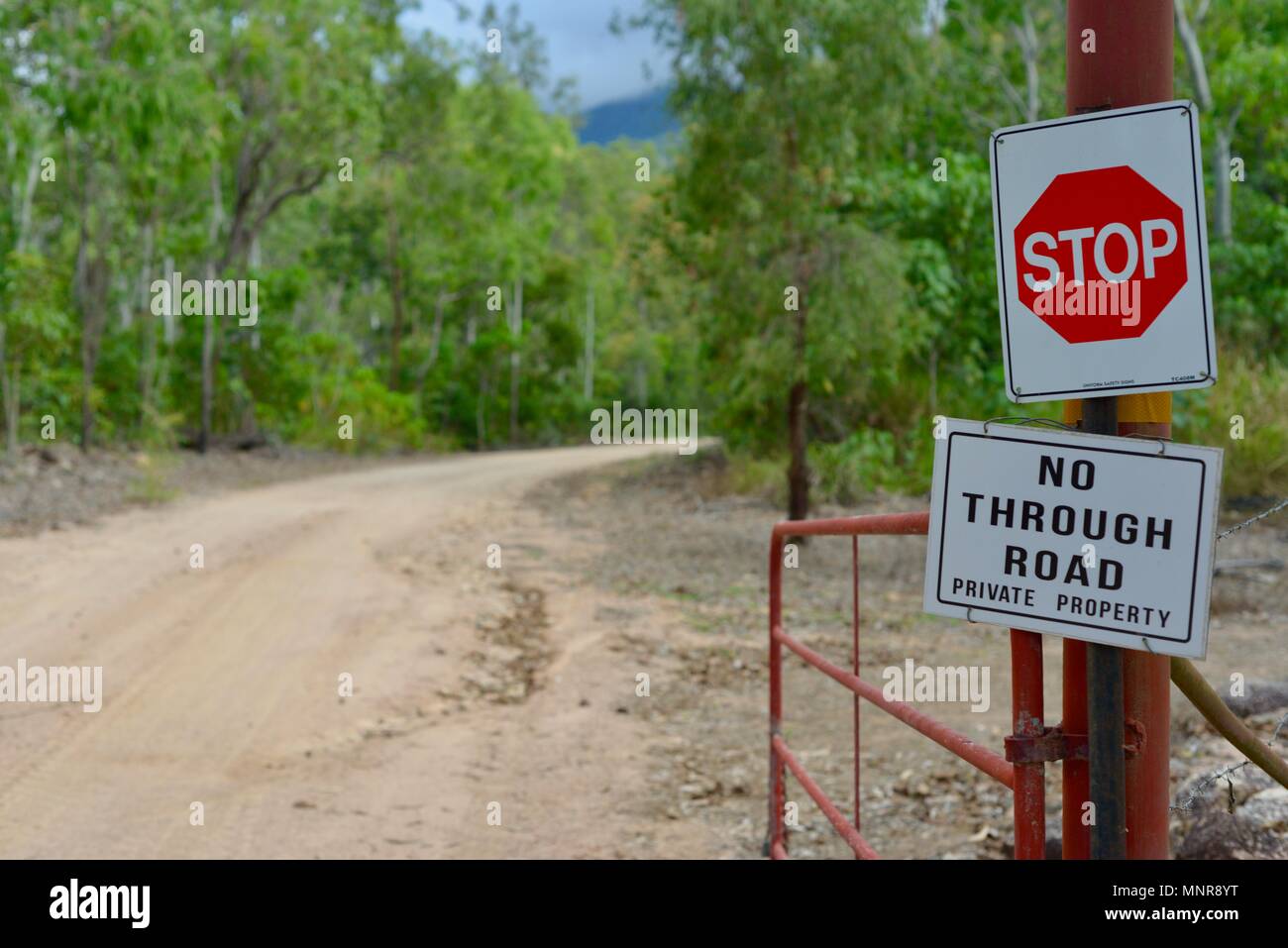 Stop and private property sign on a fence with a gate, Paluma Range ...
