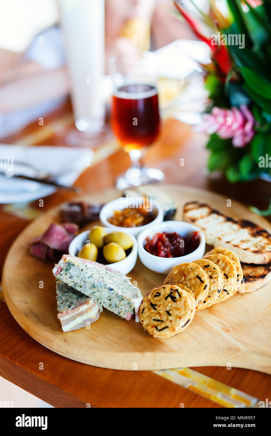 Selection of different delicious appetizers on beer platter Stock Photo ...