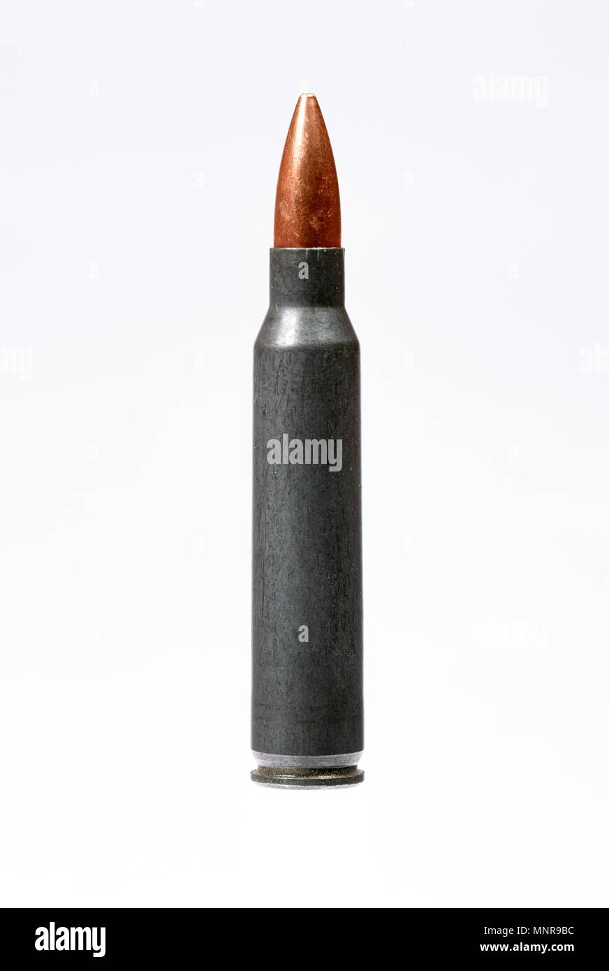 Single rifle bullet over white Stock Photo - Alamy