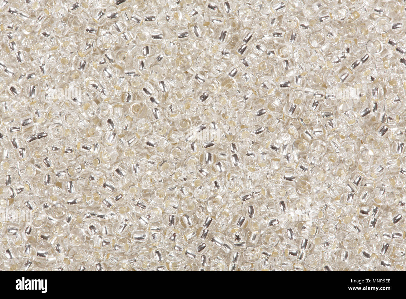 Seashell seed beads background Stock Photo - Alamy