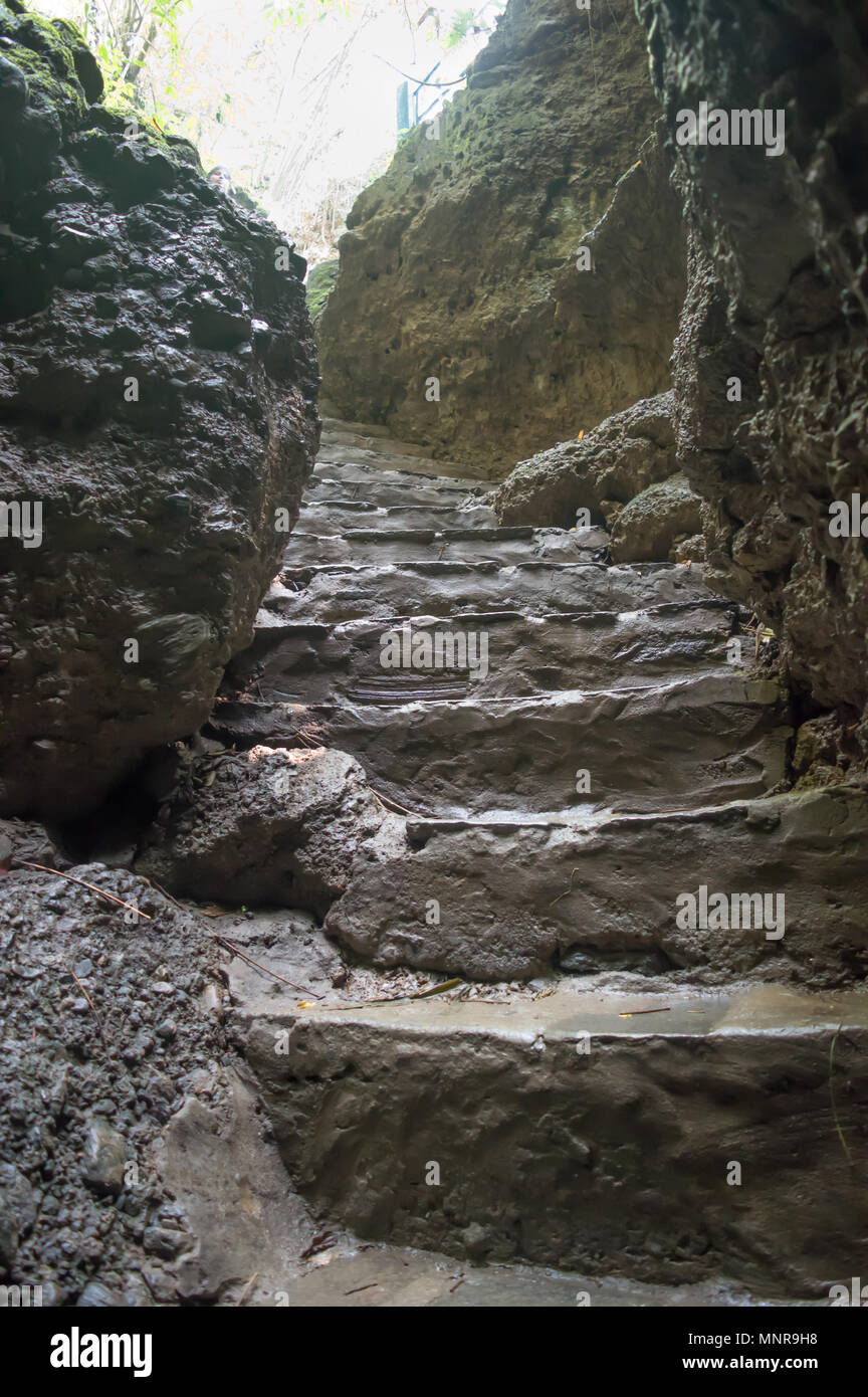 Exit of a very dark cave Stock Photo - Alamy