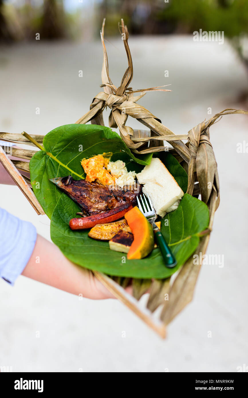 Close up of some local south pacific origin food on a weaved platter ...