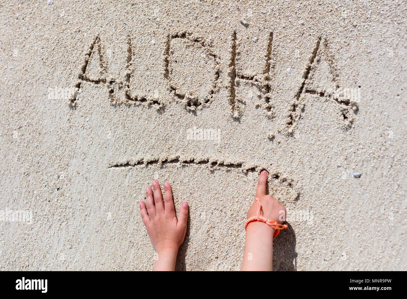 Child writing sand hi-res stock photography and images - Alamy
