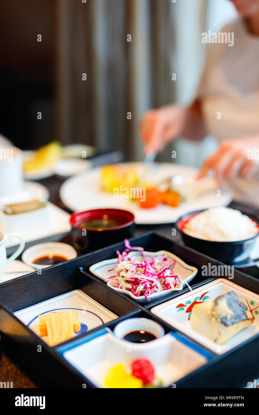 Delicious Japanese bento box with fish, omelet and vegetables Stock ...