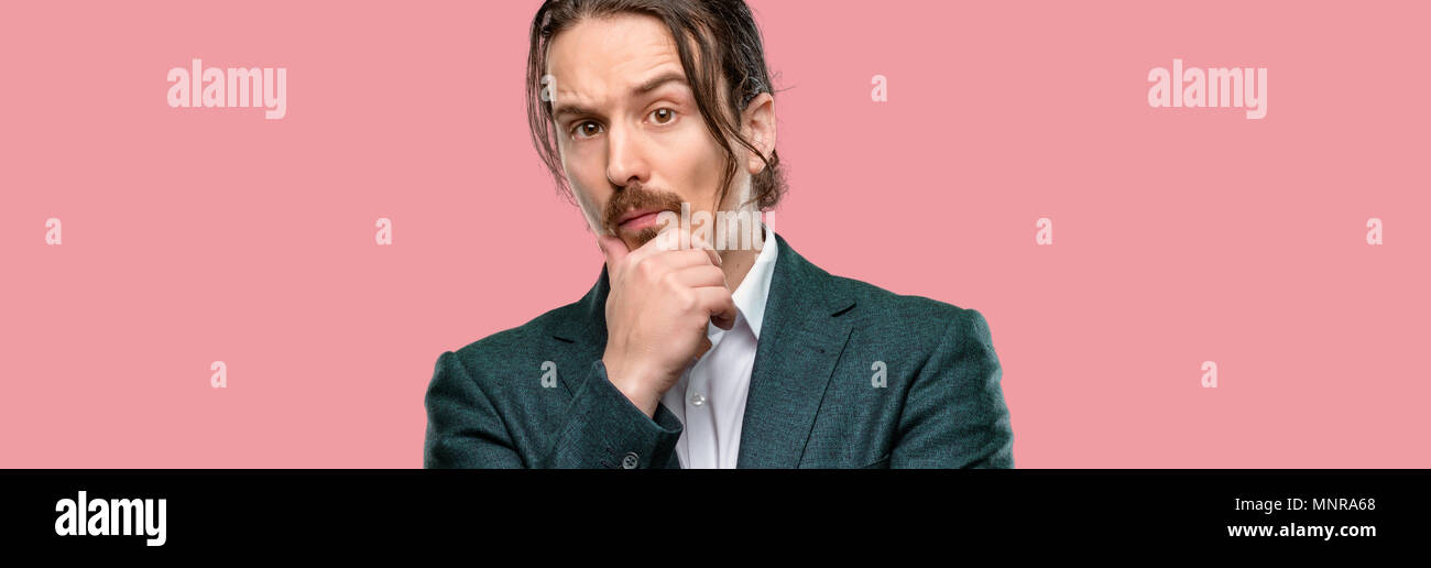 Handsome young man doubt expression, confuse and wonder concept ...