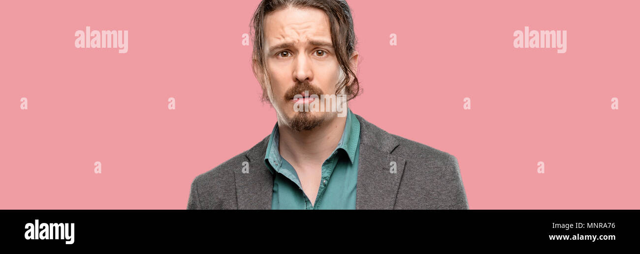 Handsome young man crying depressed full of sadness expressing sad ...